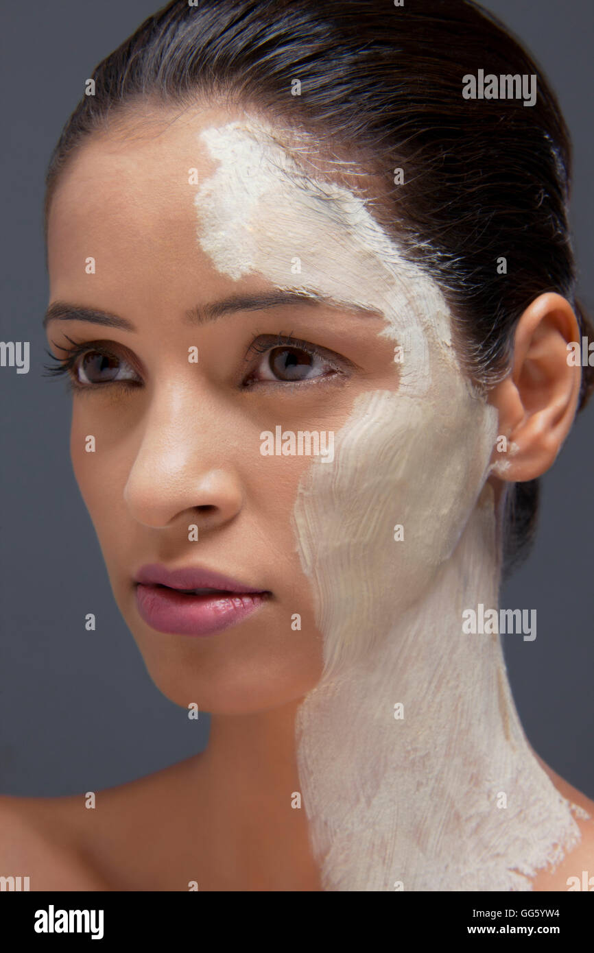 Young woman with facial mask Stock Photo - Alamy