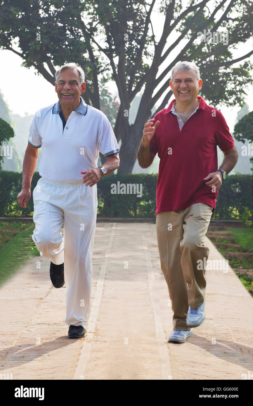 Old men jogging in a park Stock Photo - Alamy