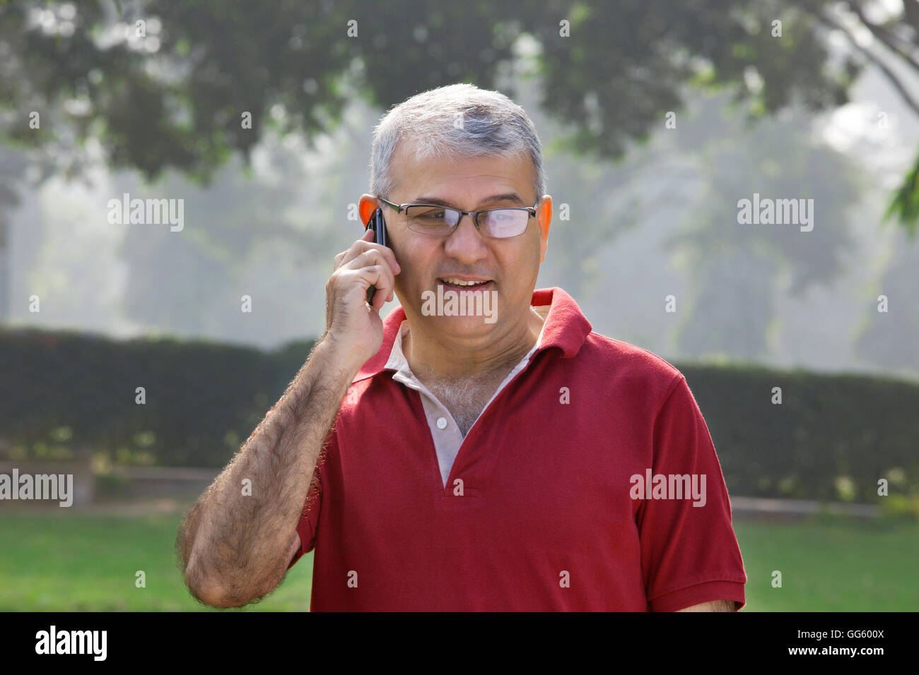 Old man talking on a mobile phone Stock Photo - Alamy