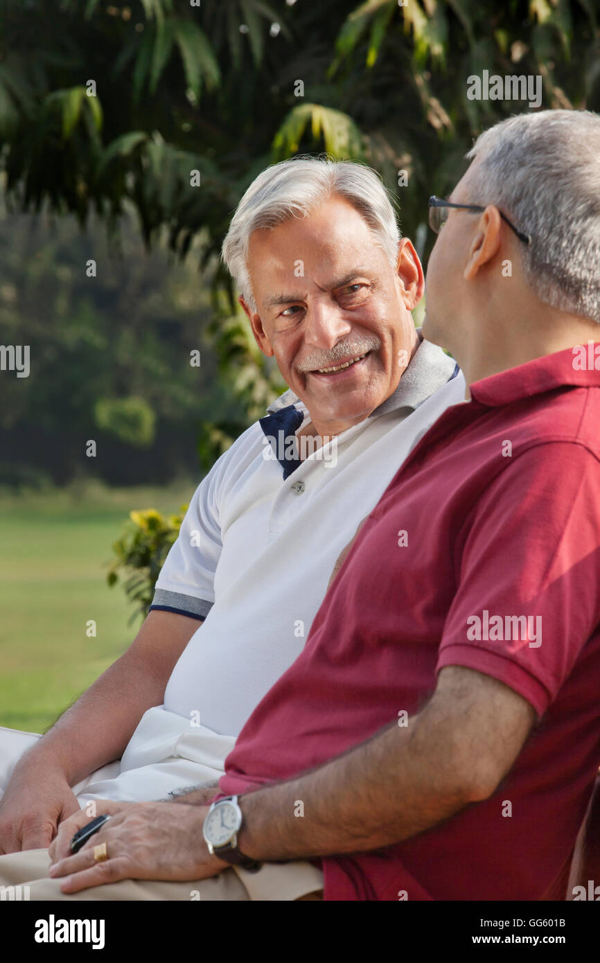 Old men sitting in a park Stock Photo - Alamy