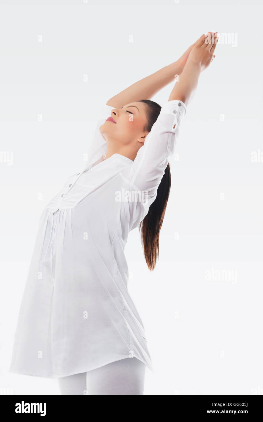 Woman practicing backward bend pose Stock Photo - Alamy