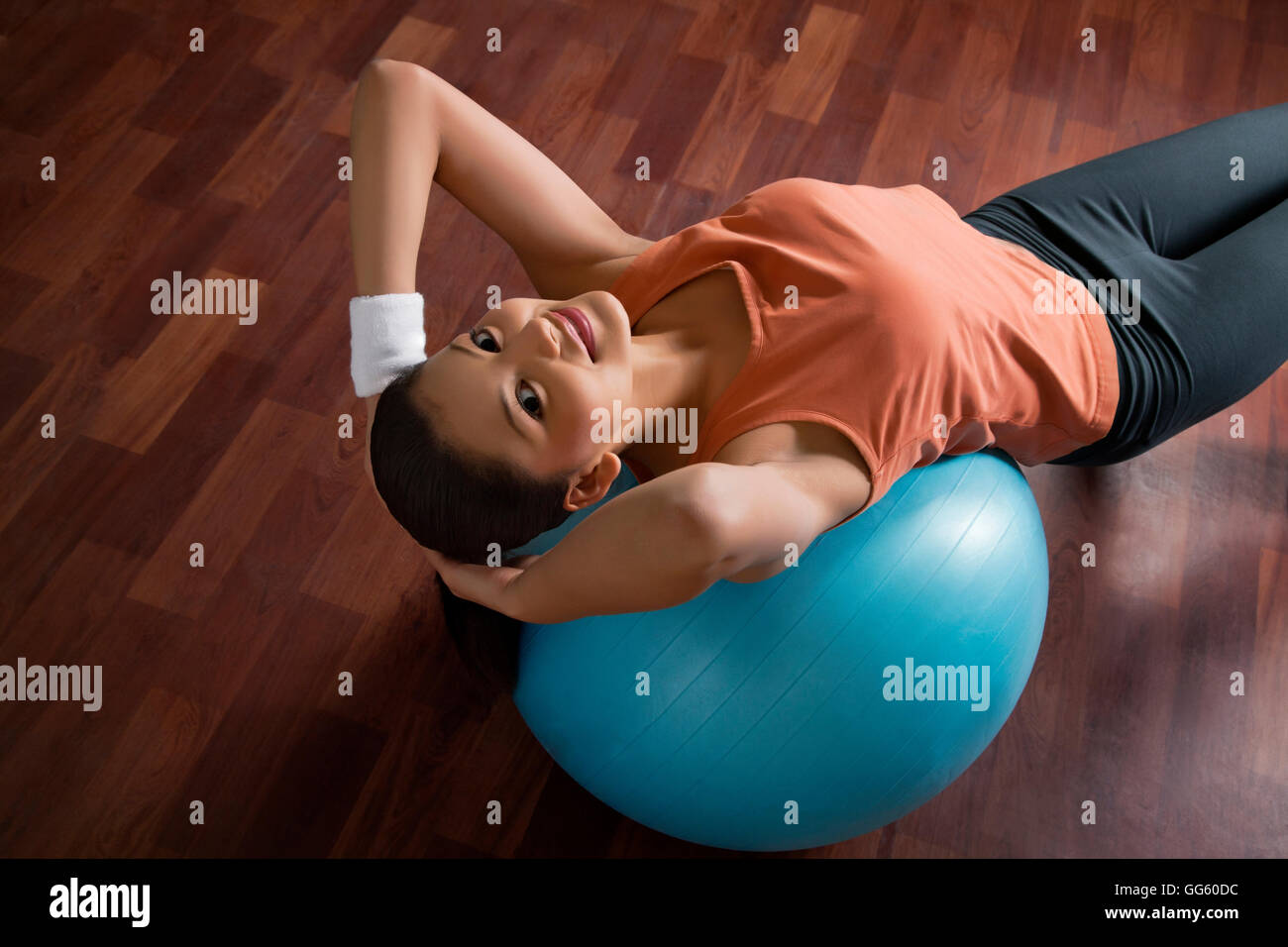 High angle view of a young woman balancing on exercise ball Stock Photo ...