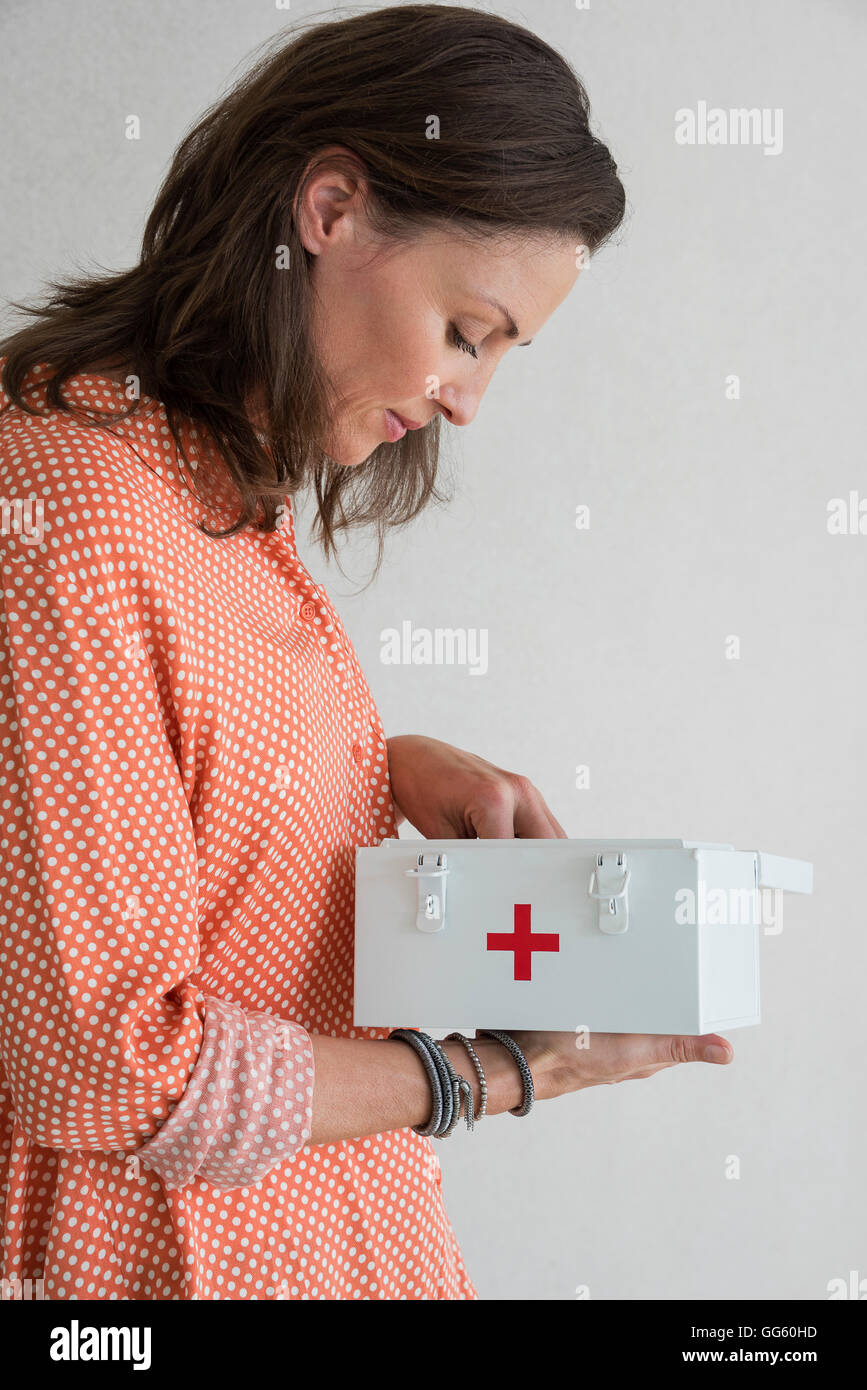 First aid kit woman hi-res stock photography and images - Alamy