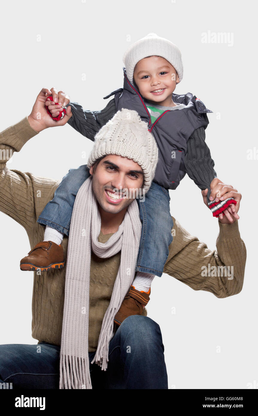 Son and father in playful mood white background Stock Photo - Alamy
