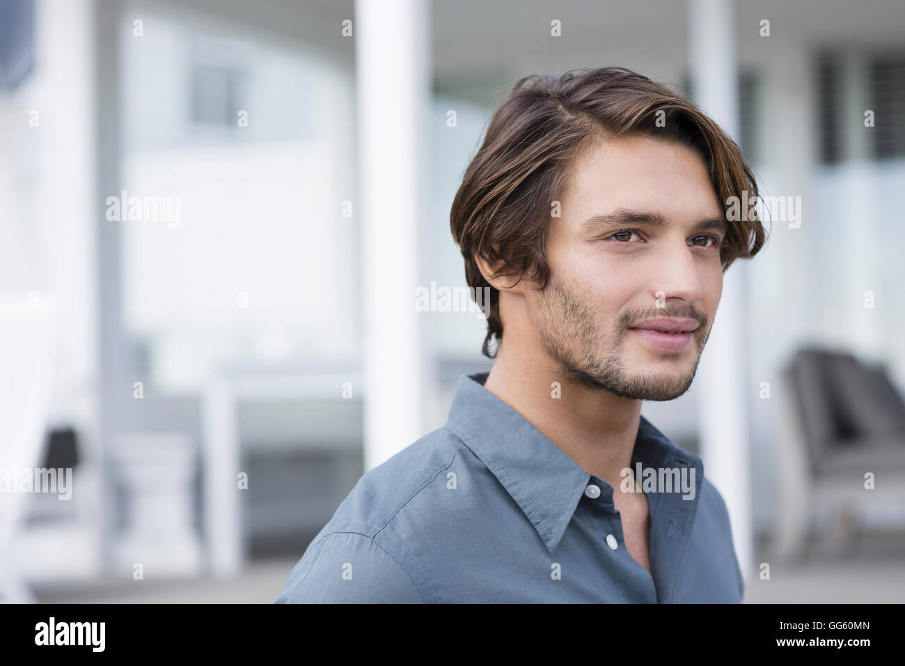 Content handsome man standing hi-res stock photography and images - Alamy
