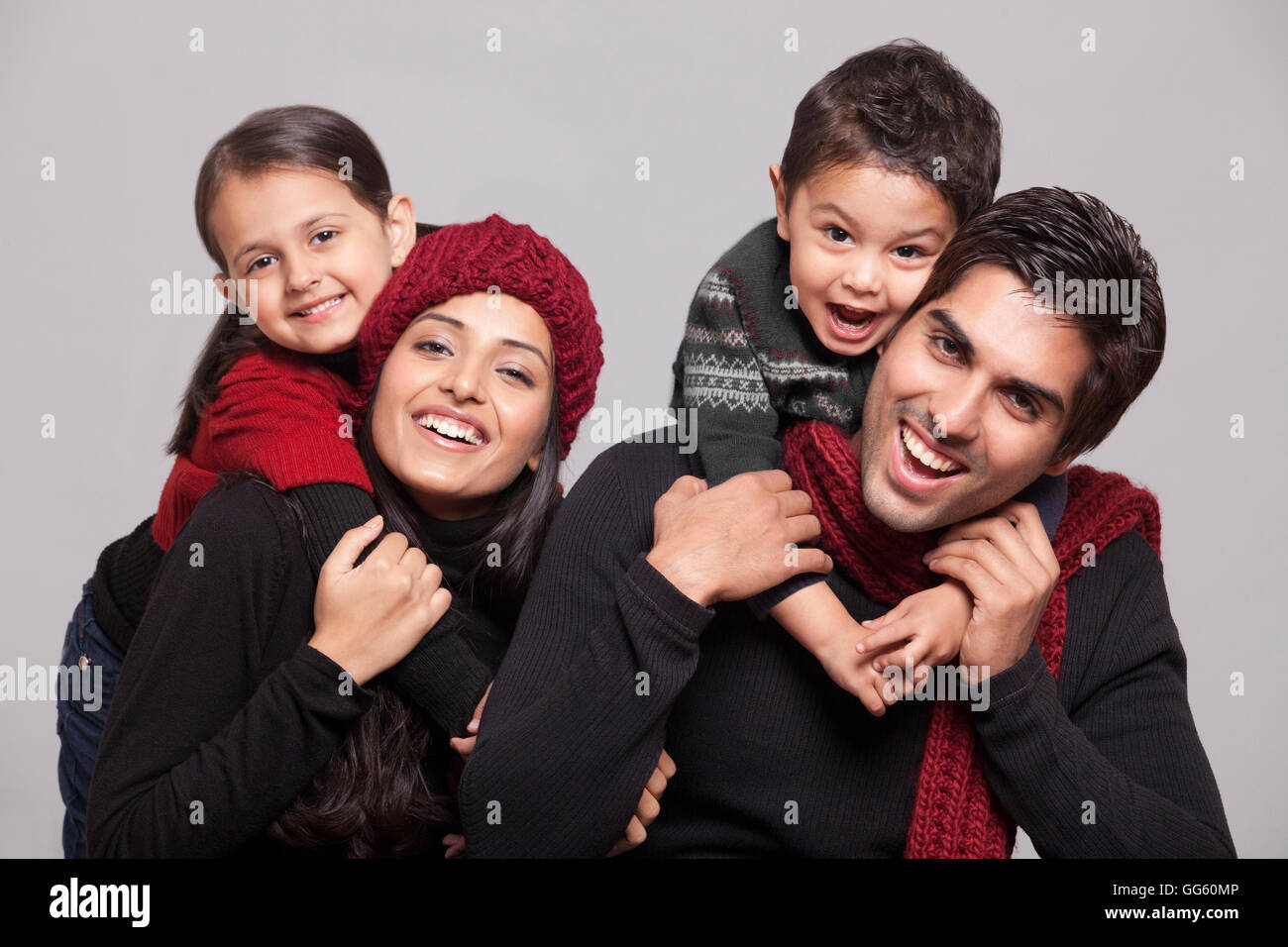 Portrait of parents and children over grey background Stock Photo - Alamy