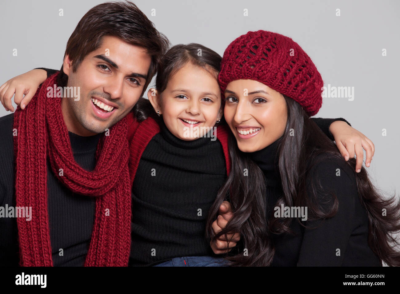 Portrait of happy family over grey background Stock Photo - Alamy