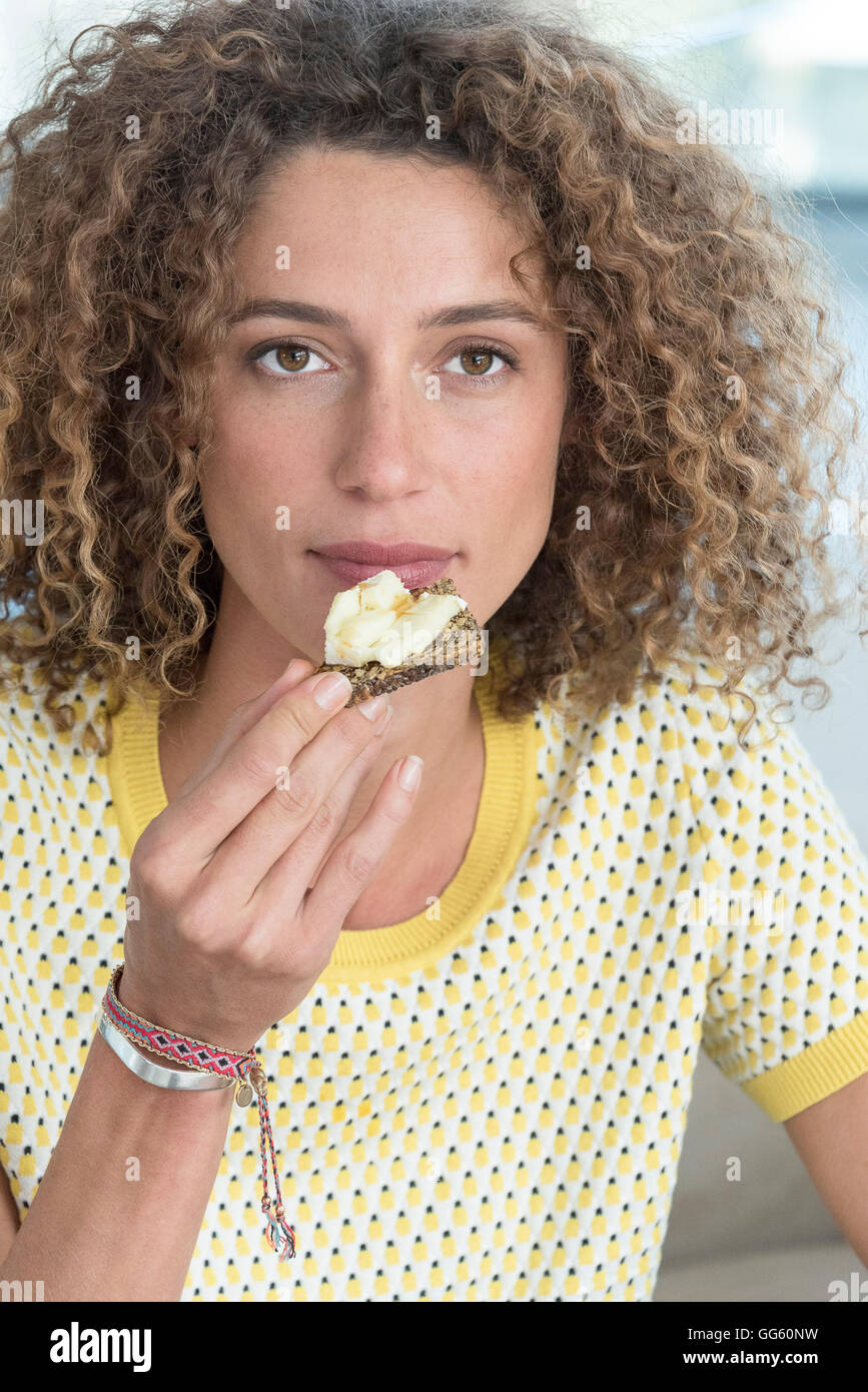 Woman eating cheese hi-res stock photography and images - Alamy
