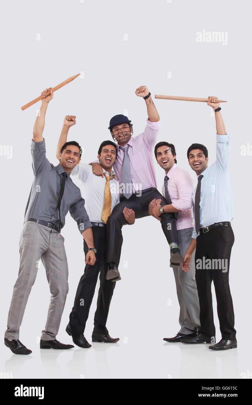 Executives cheering during cricket match Stock Photo - Alamy