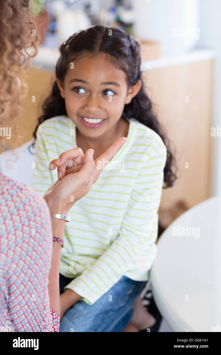 Happy mother and daughter talking at home Stock Photo - Alamy