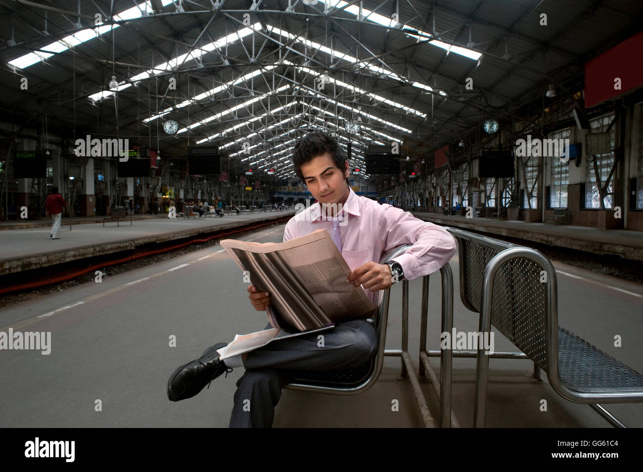 Asian man newspaper train hi-res stock photography and images - Alamy
