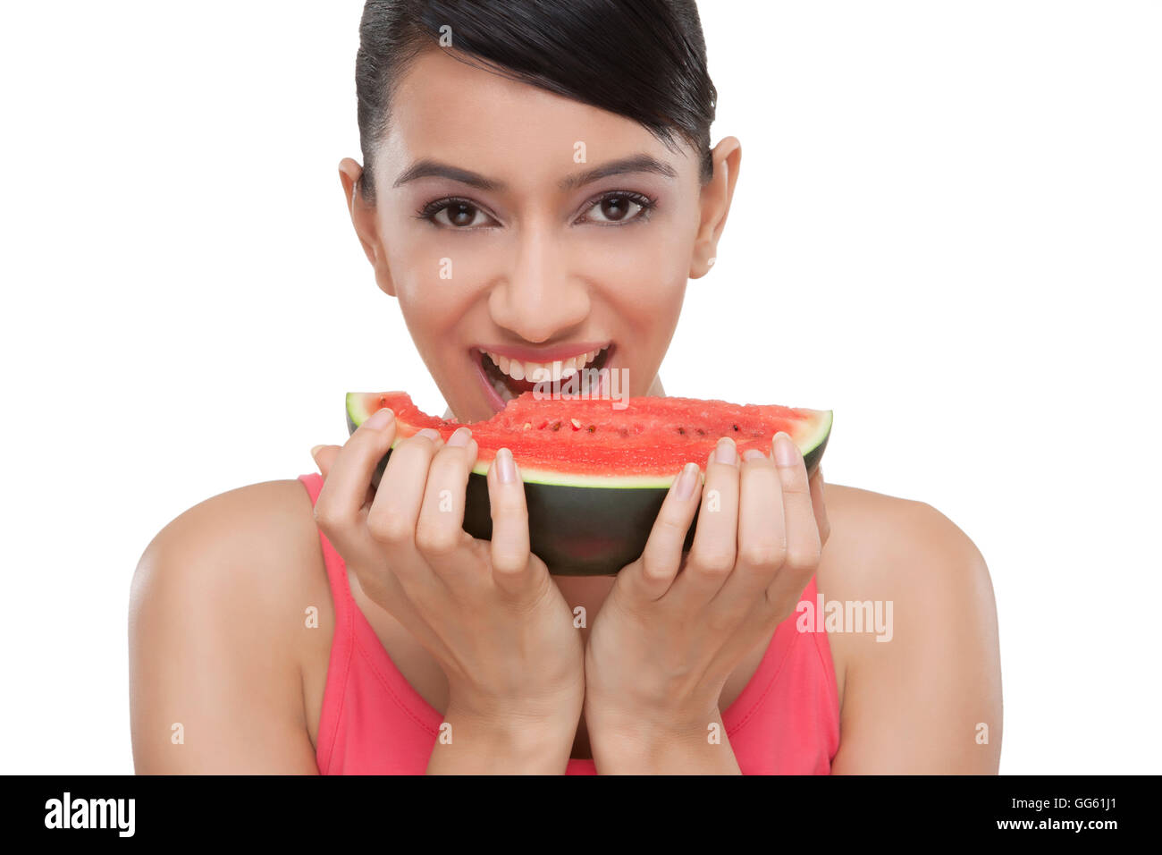 Portrait of beautiful young woman biting slice of watermelon Stock ...