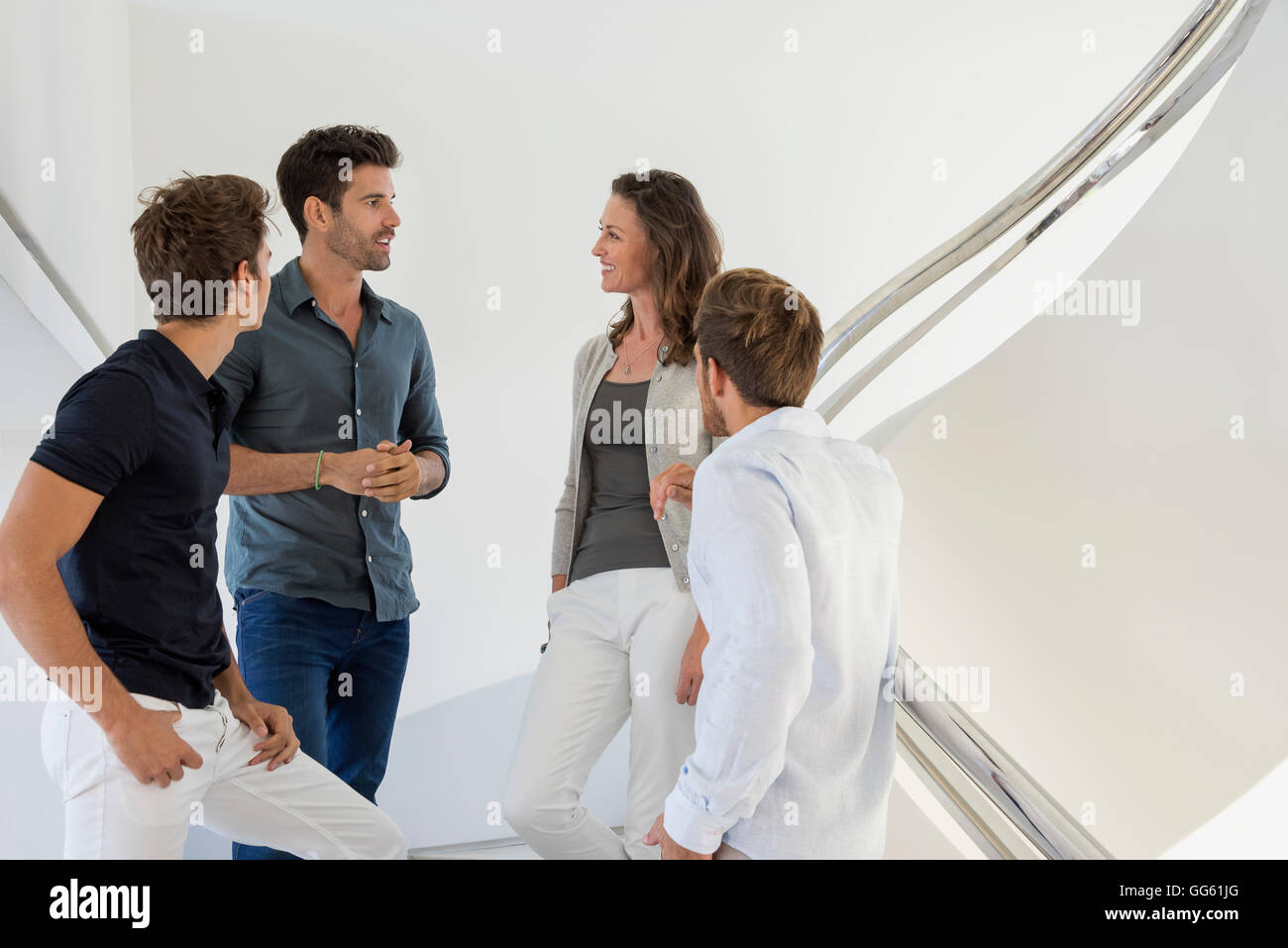 Business friends talking to each other Stock Photo - Alamy