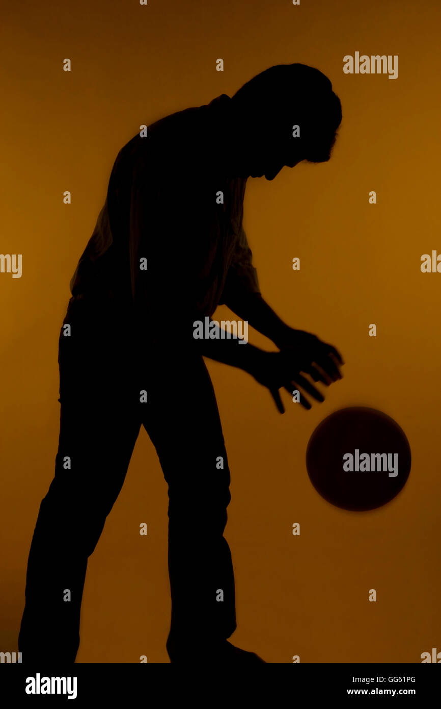 Man playing with a ball Stock Photo - Alamy