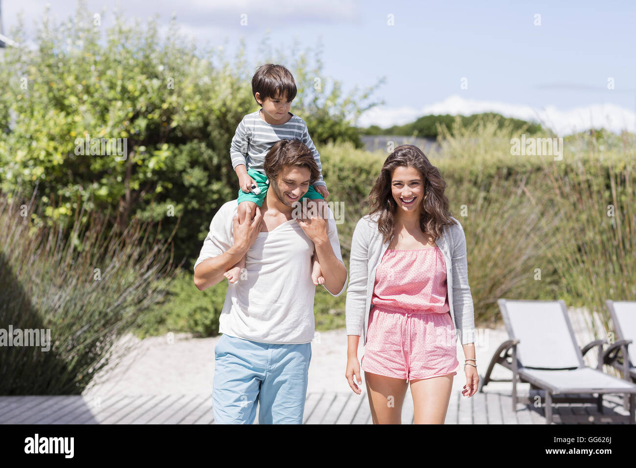 Family enjoying together at poolside Stock Photo - Alamy