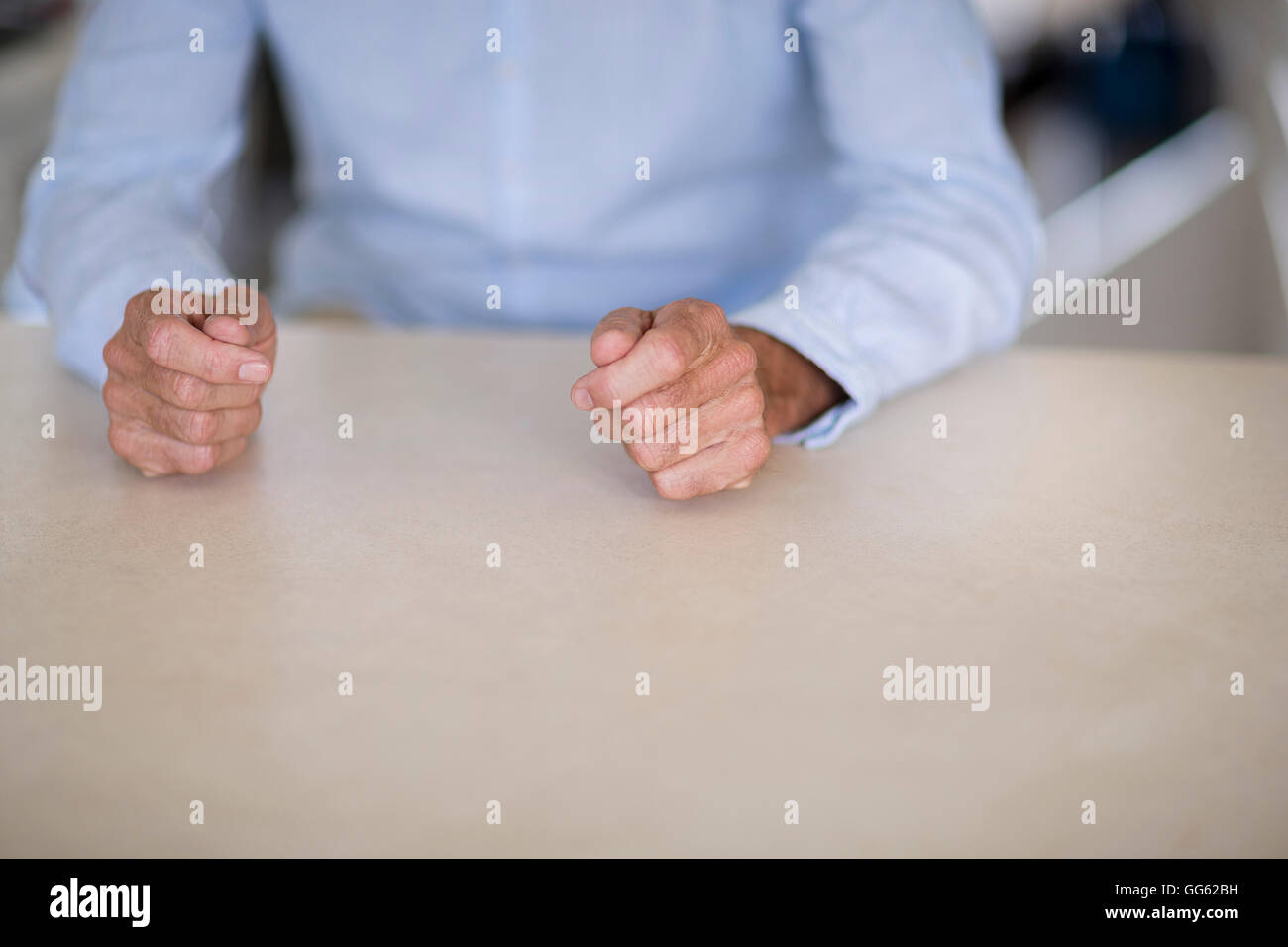 Mid section view of a senior man sitting Stock Photo - Alamy