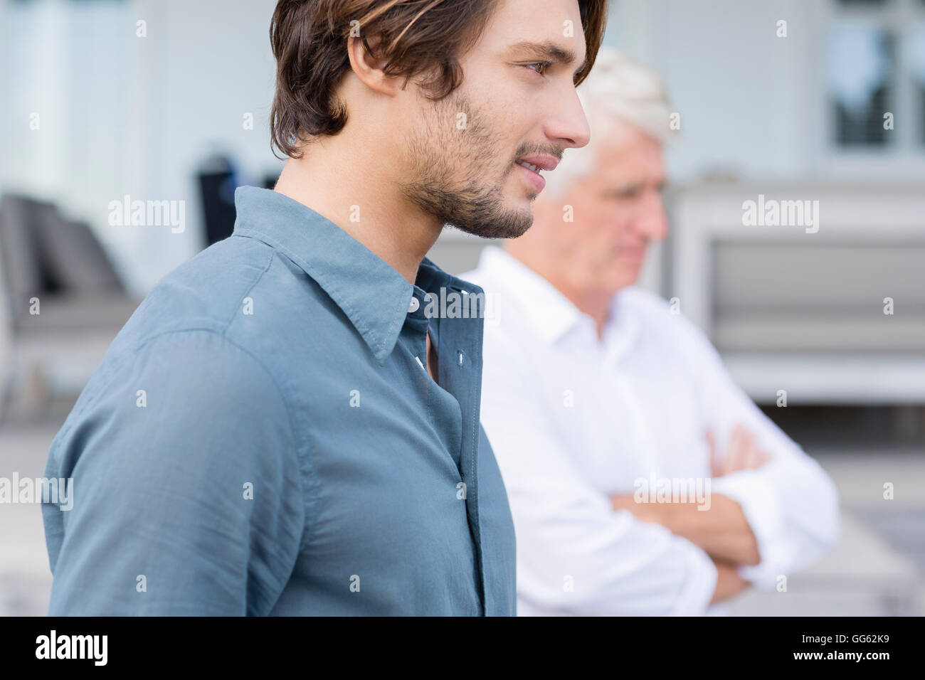 Father and son standing together outside Stock Photo - Alamy