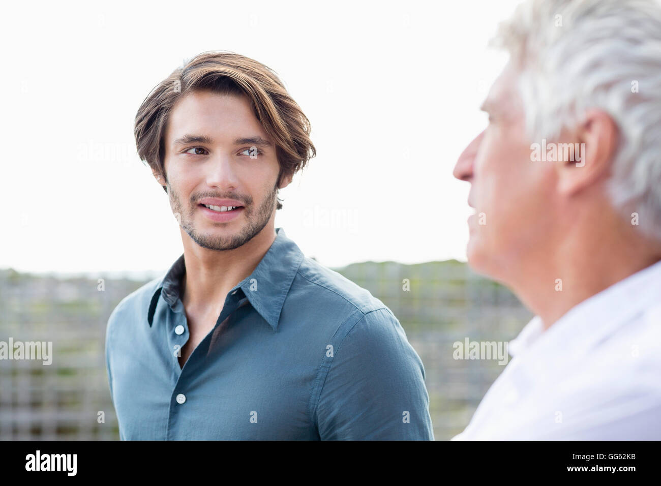Happy father and son talking outside Stock Photo - Alamy