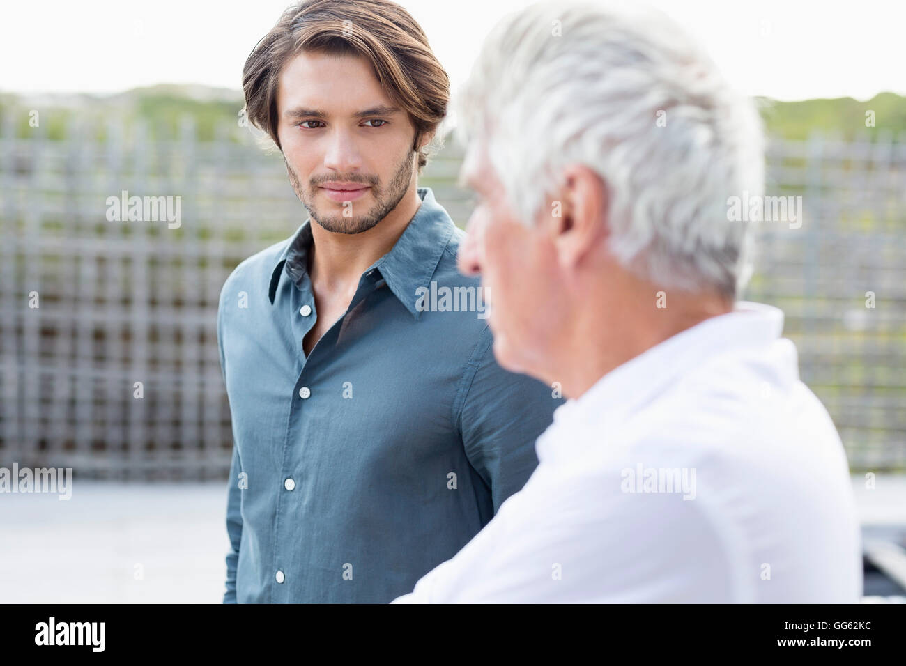 Two men standing talking outside hi-res stock photography and images ...