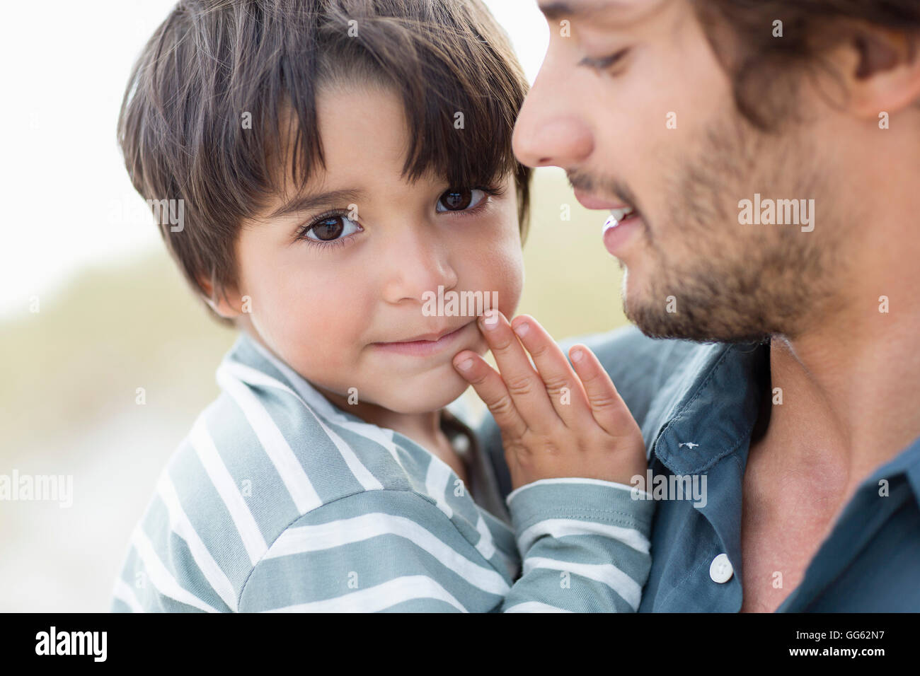 Close-up of a boy with his father Stock Photo - Alamy