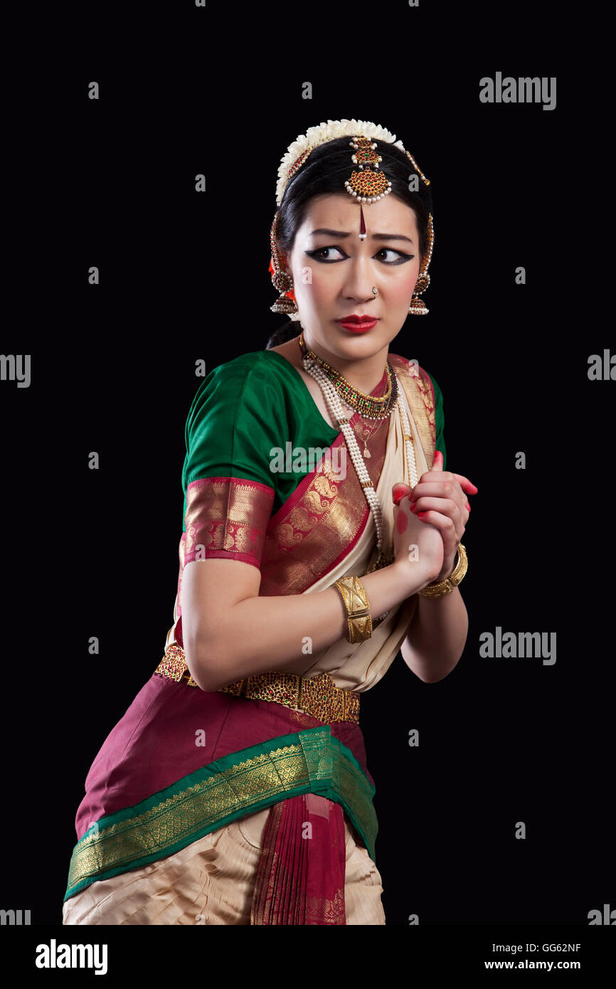 Sacred Bharatanatyam dancer performing over black background Stock ...