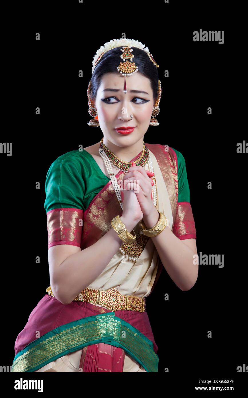 Scared Bharatanatyam dancer performing on black background Stock Photo ...