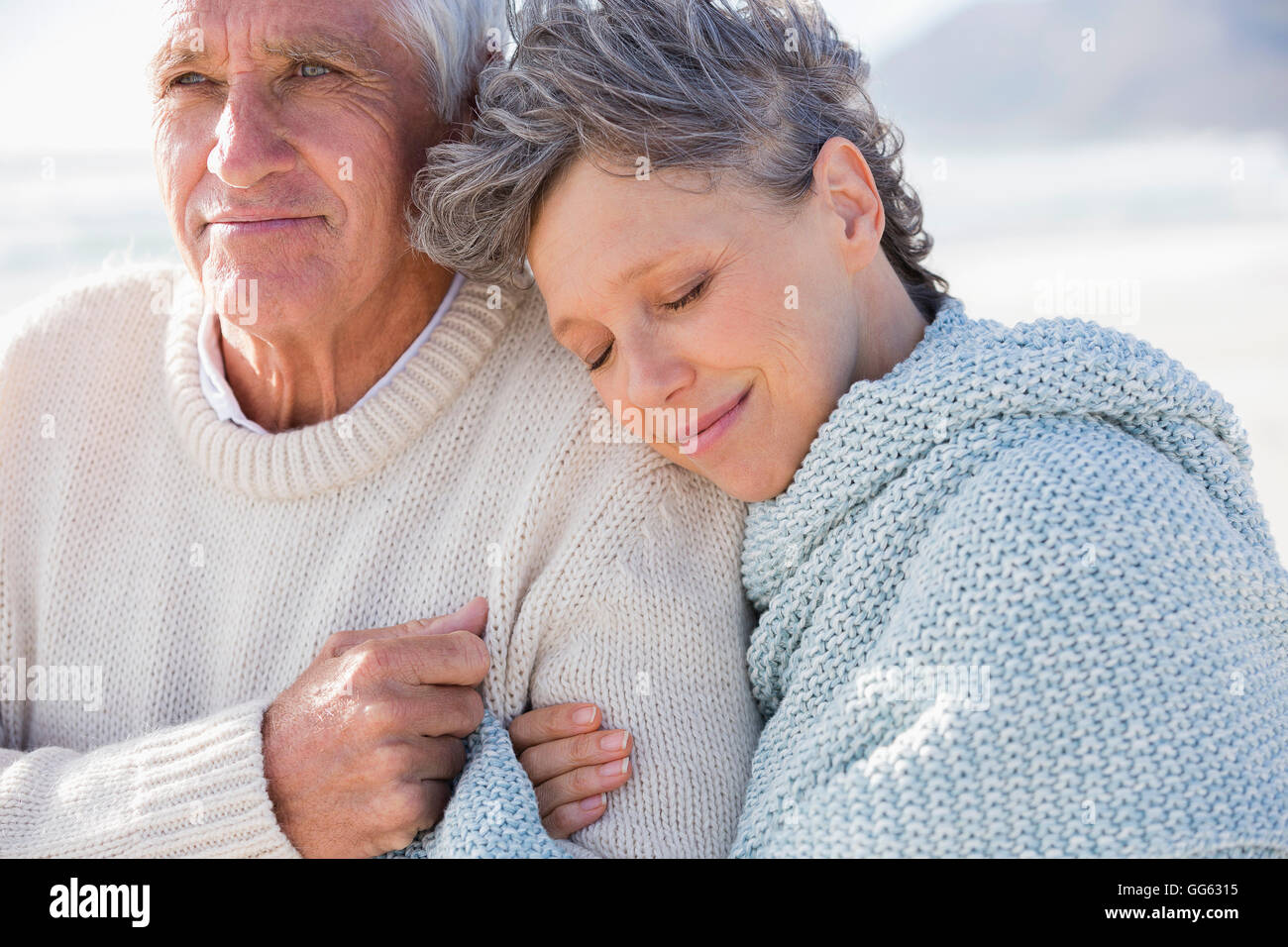 Woman relaxing on the shoulder of her husband Stock Photo - Alamy