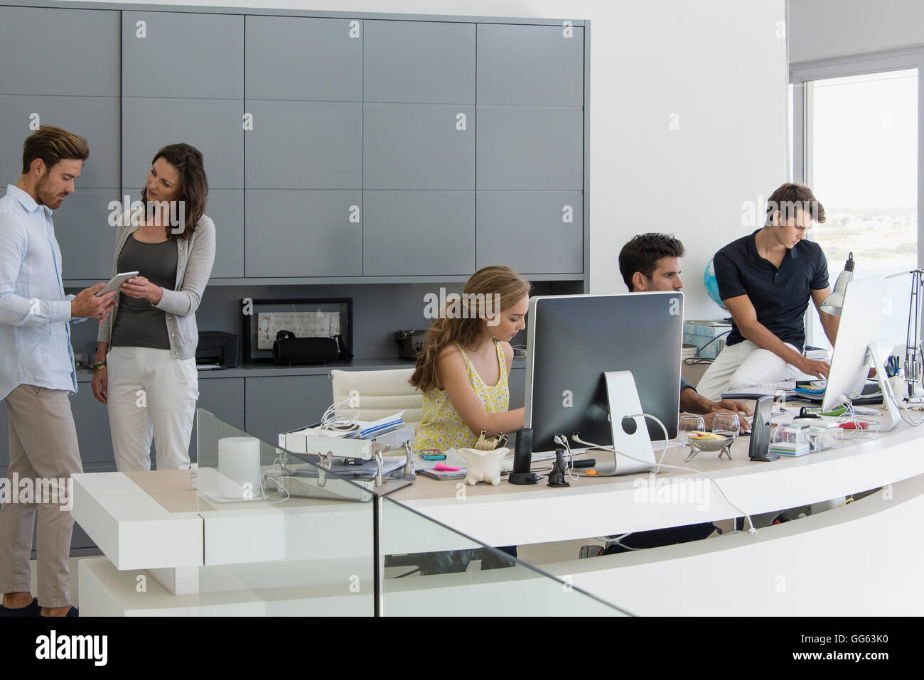 Business executives working in office Stock Photo - Alamy