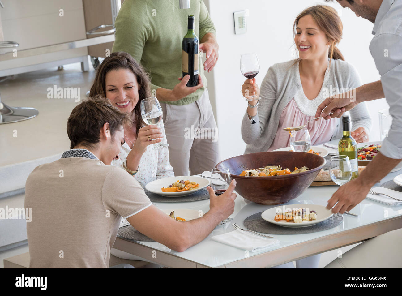 Happy friends enjoying party at home Stock Photo - Alamy