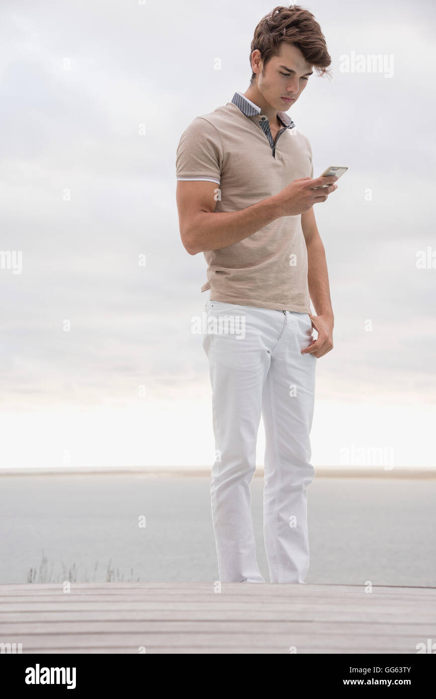 Caucasian man using smart hi-res stock photography and images - Alamy