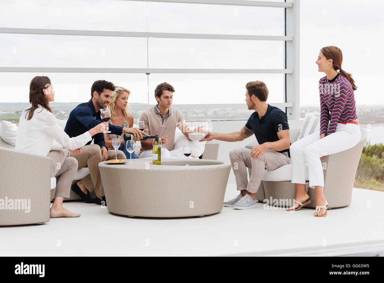 Group of friends enjoying party at resort Stock Photo - Alamy