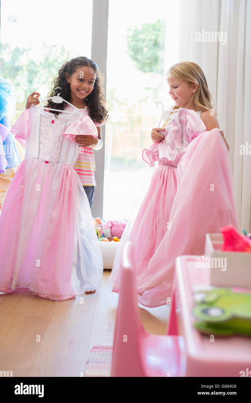 Two little girls shopping at clothing store Stock Photo - Alamy