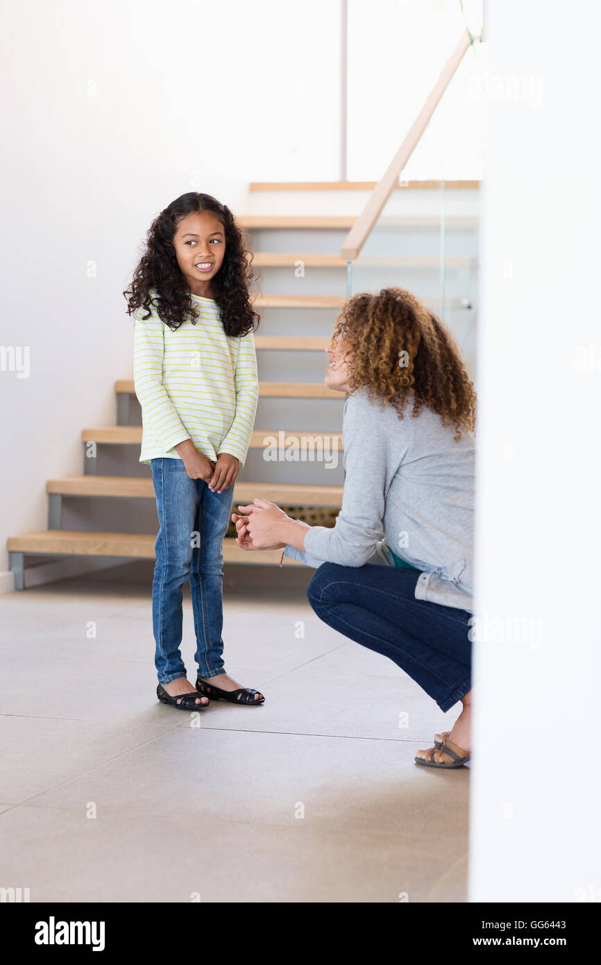 Happy mother and daughter talking at home Stock Photo - Alamy