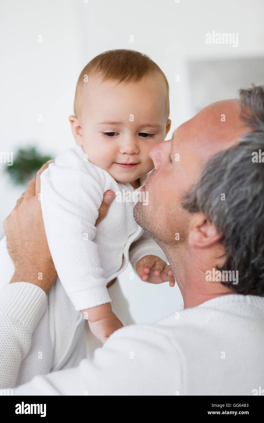 Happy father loving his cute baby daughter at home Stock Photo - Alamy