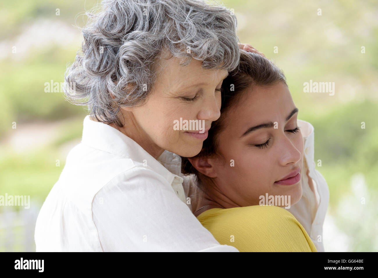 Loving mother hugging her adult daughter Stock Photo - Alamy