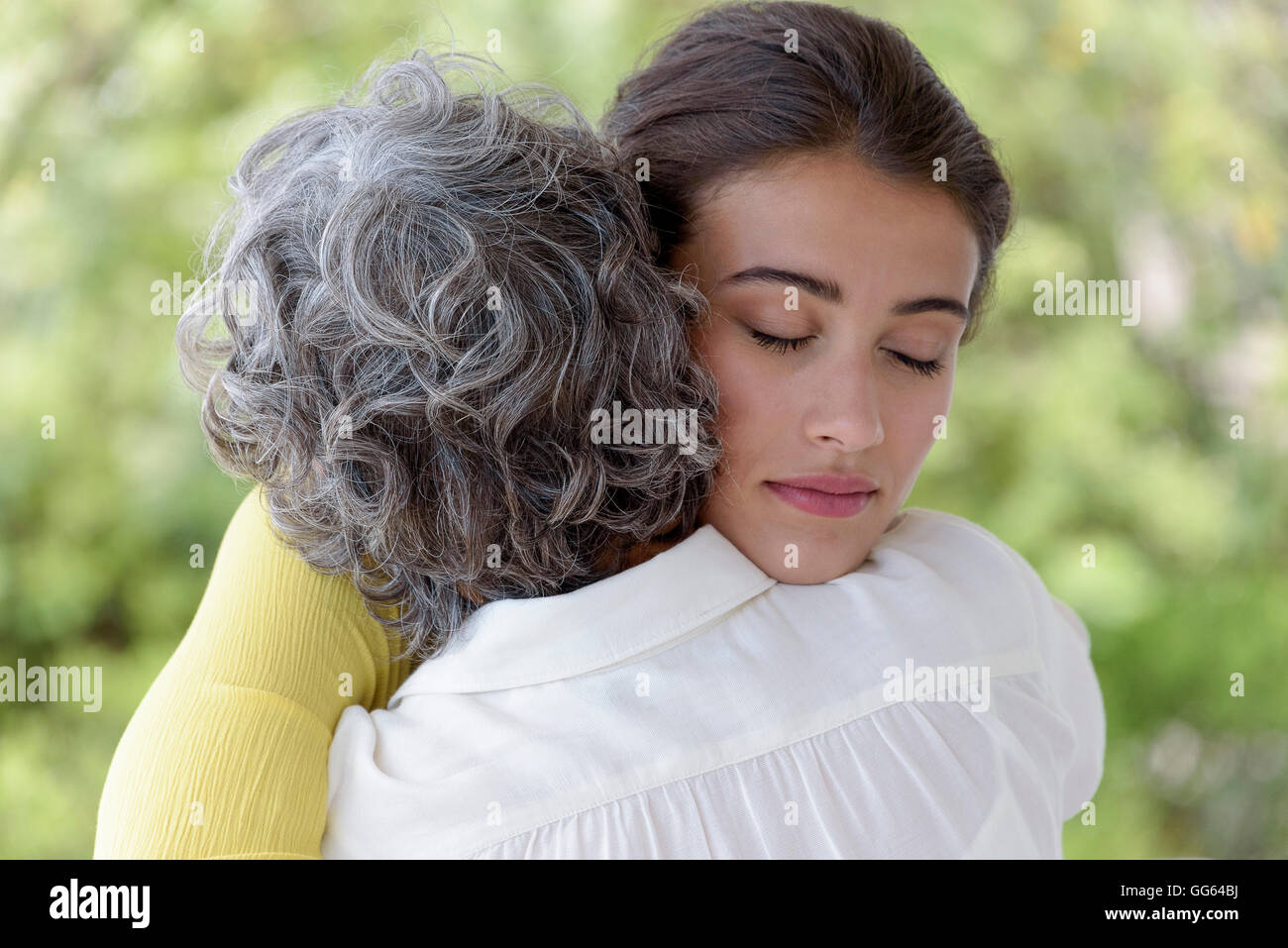 Loving mother hugging her adult daughter Stock Photo - Alamy
