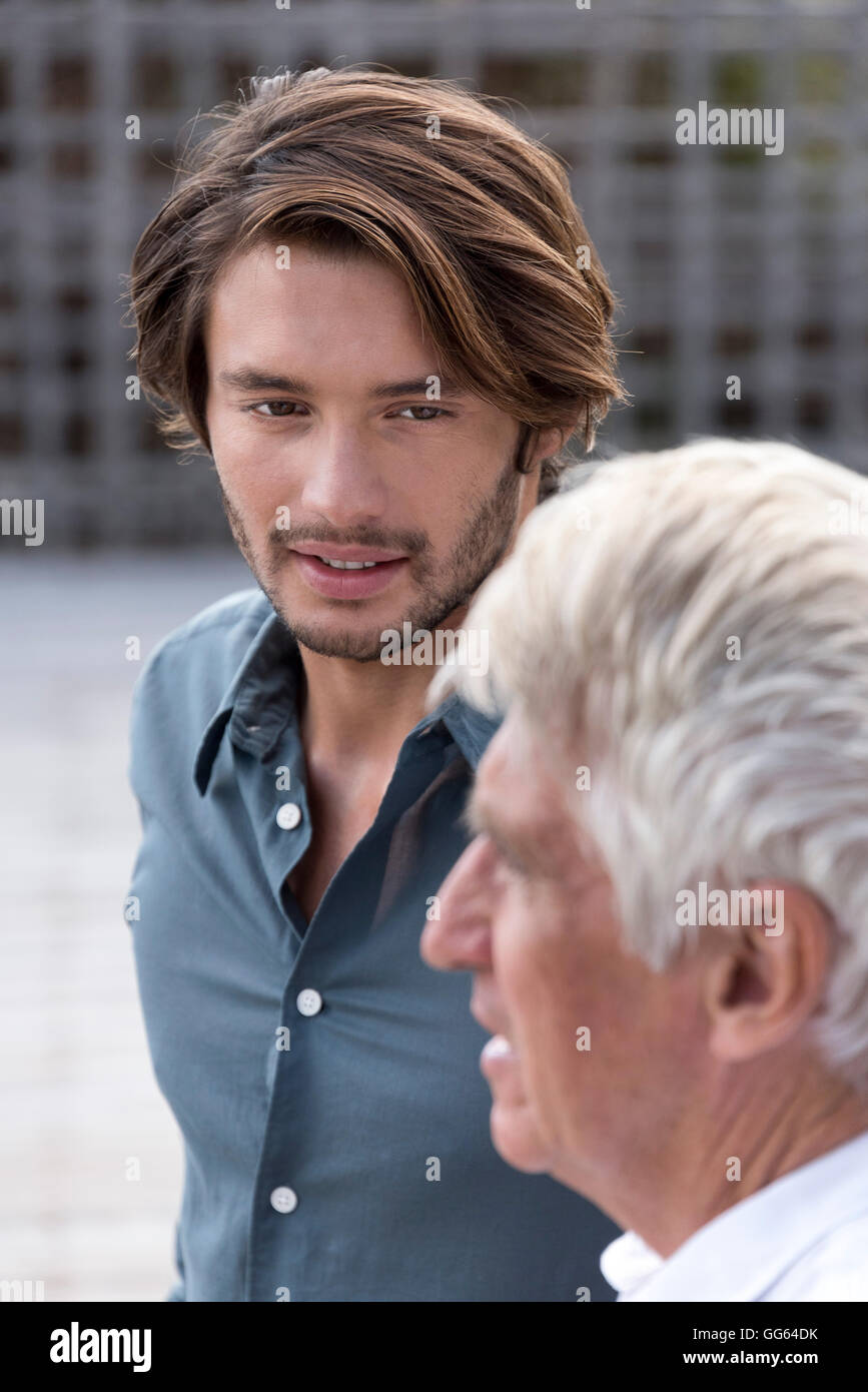 Father and son talking outside Stock Photo - Alamy