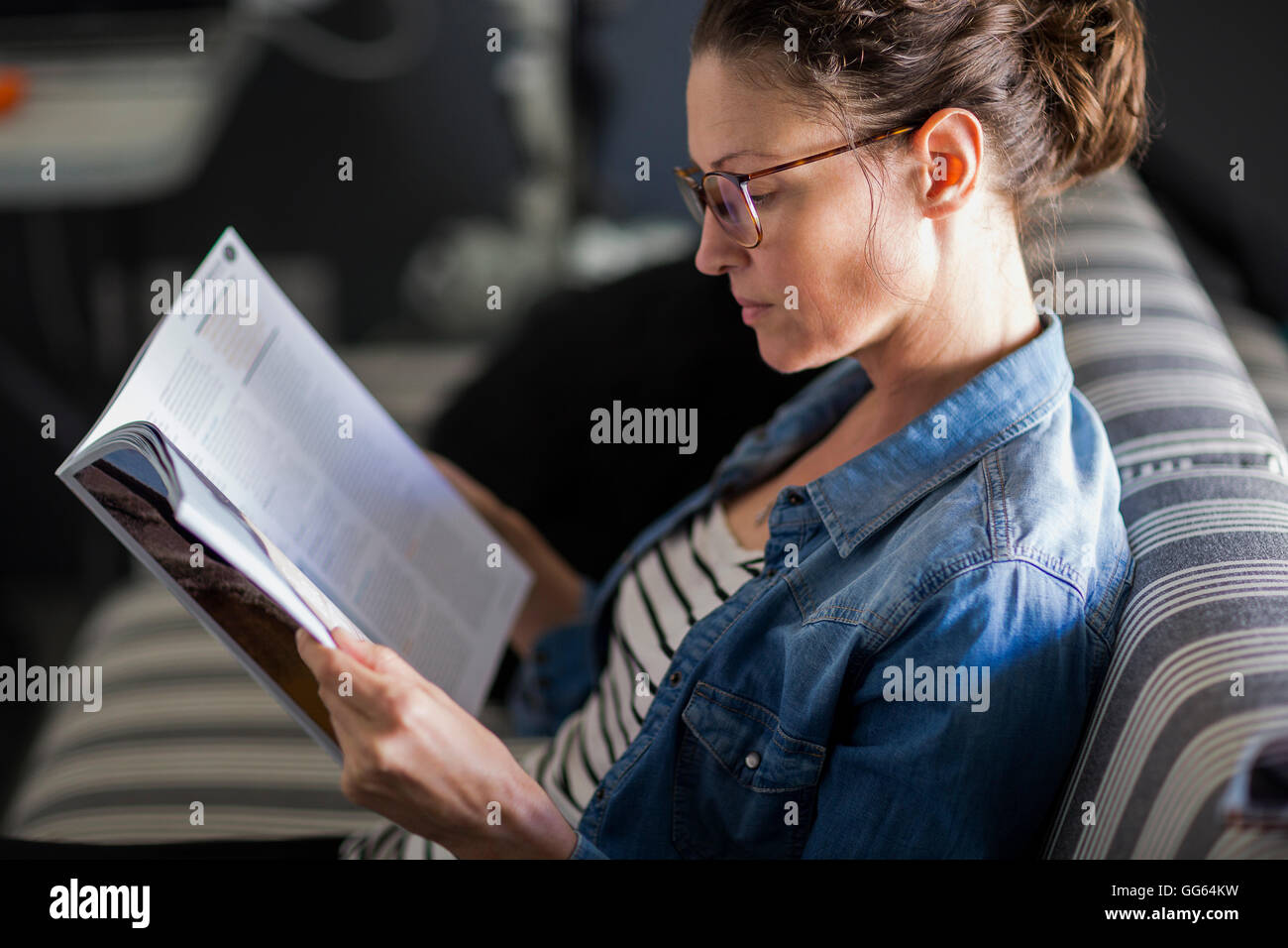 Close-up of a beautiful woman reading a magazine Stock Photo - Alamy