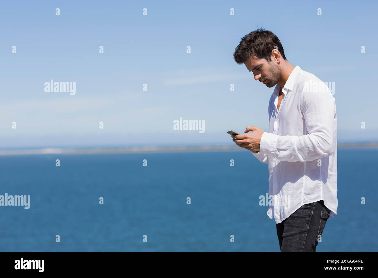 Profile of a man using a smart phone Stock Photo - Alamy