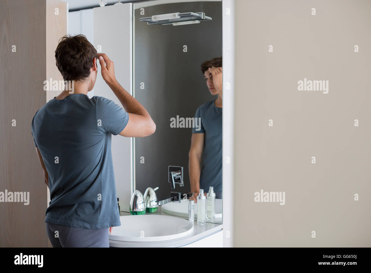 Man body checking mirror hi-res stock photography and images - Alamy