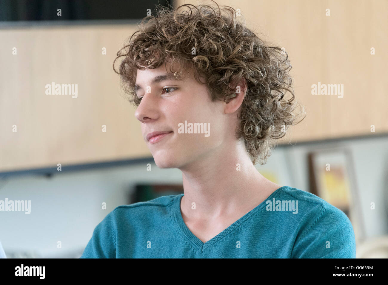 Happy teenage boy thinking Stock Photo - Alamy