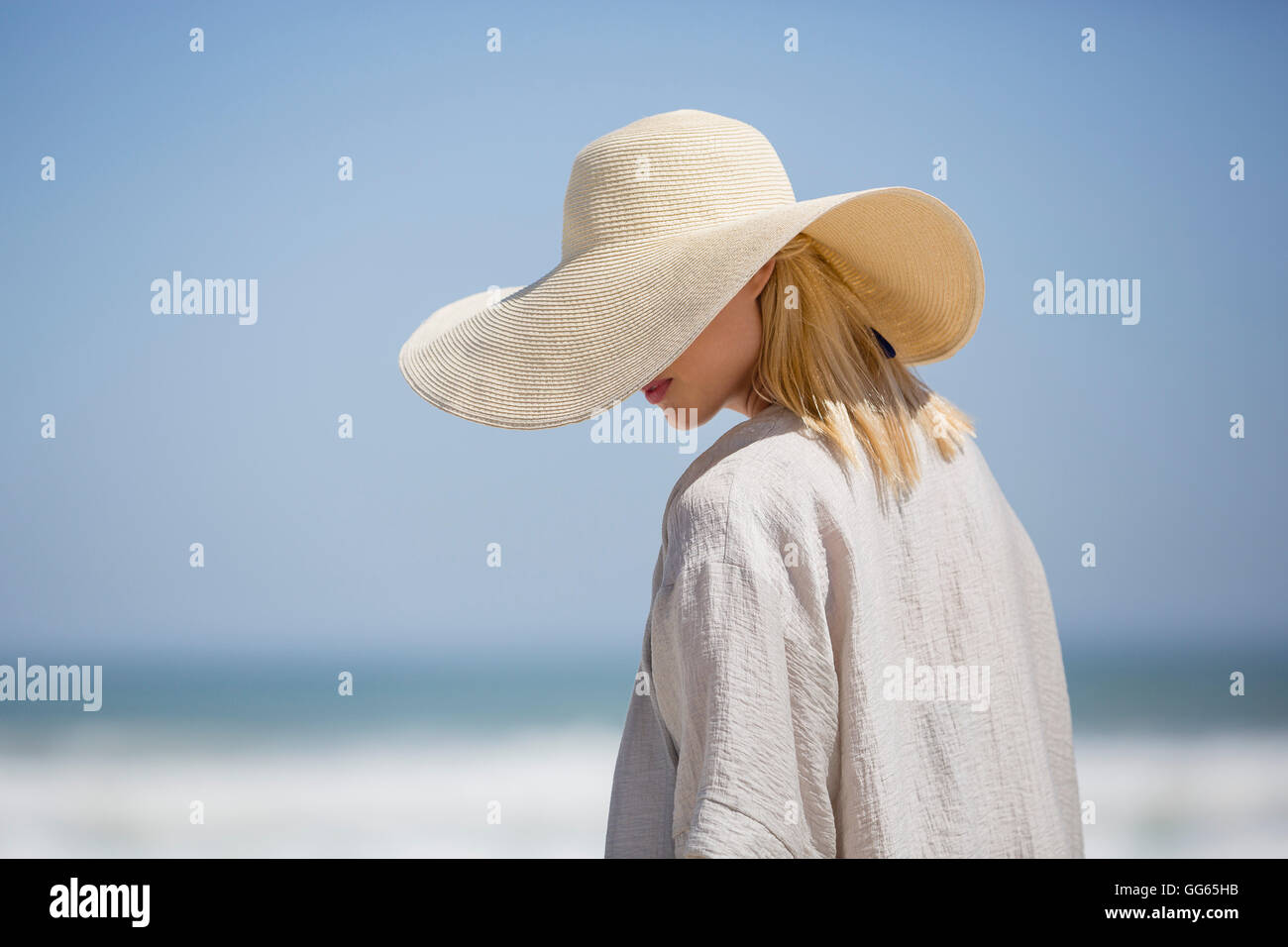 Woman Wearing Sunhat On Beach High Resolution Stock Photography and ...