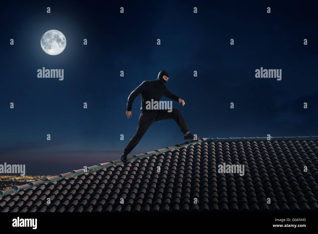 Thief on the roof Stock Photo - Alamy