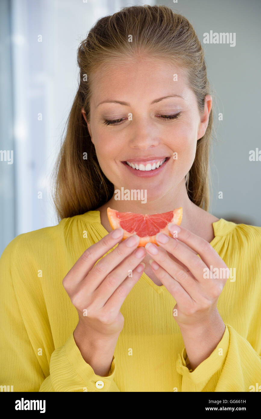 Woman eating grapefruit hi-res stock photography and images - Alamy