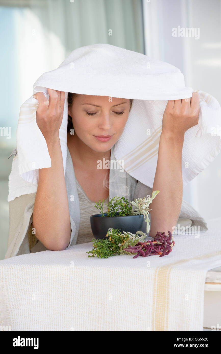 Beautiful woman smelling fresh aroma herbs Stock Photo - Alamy
