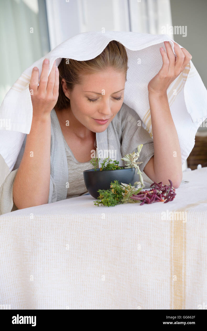 Beautiful woman smelling fresh aroma herbs Stock Photo - Alamy