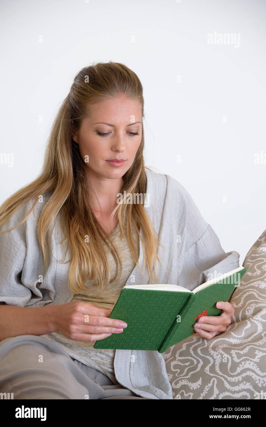 Woman reading a book Stock Photo - Alamy
