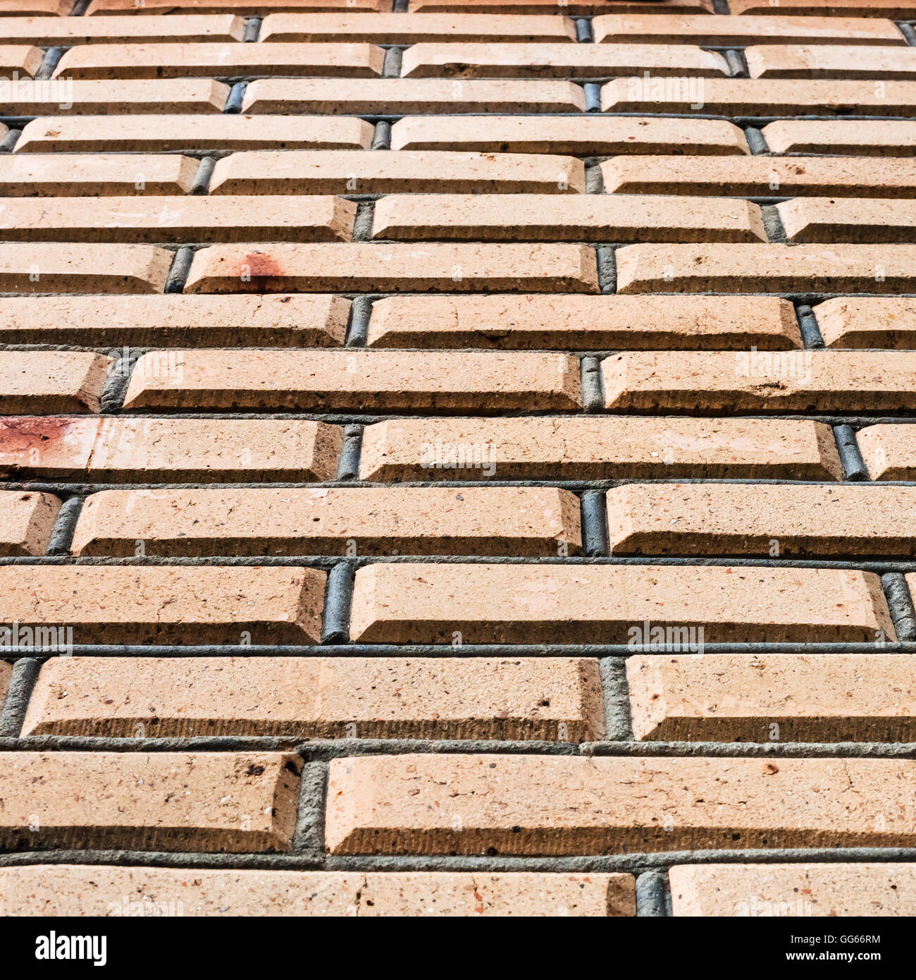 square construction background - bottom view of brick wall close up ...