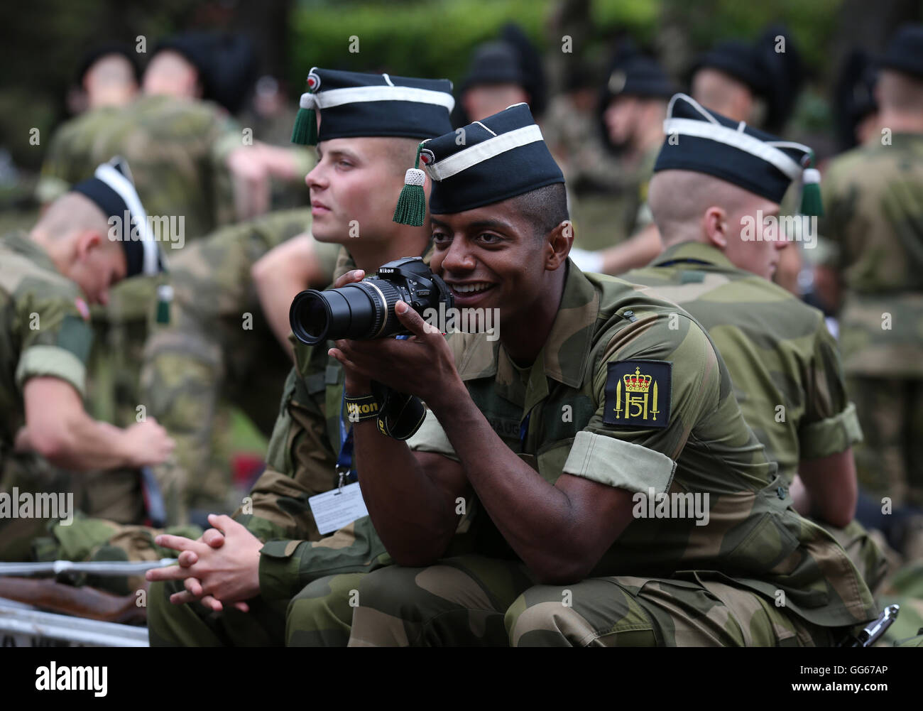 Members of the His Majesty The Kings Guard of Norway relax during a ...
