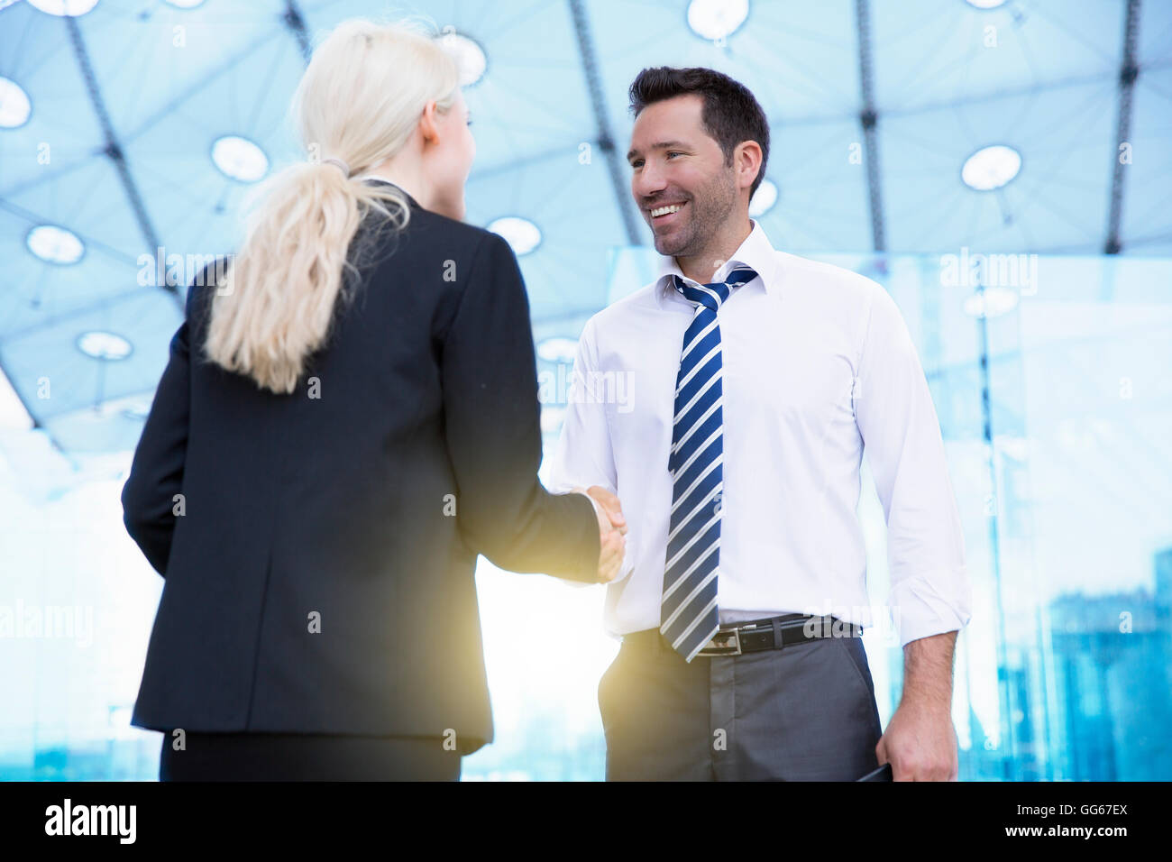 Two business people hand shake hi-res stock photography and images - Alamy